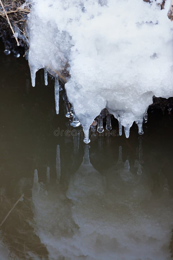 Icicles Over a Waterfall stock image. Image of water - 35983827