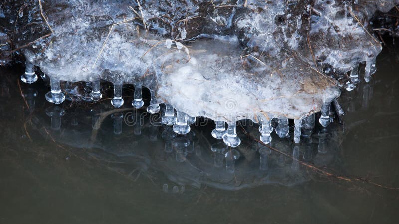 Small Round Icicles Over Water Stock Image - Image of small, nature ...