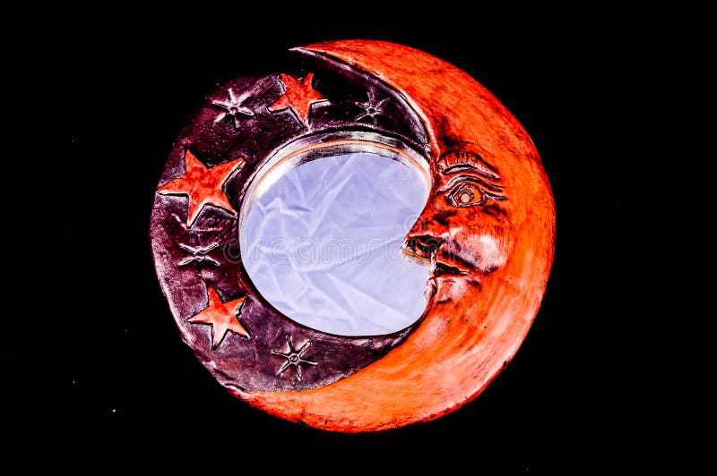 A Small, Round, Red and Black Moon with Stars on it Stock Photo - Image ...