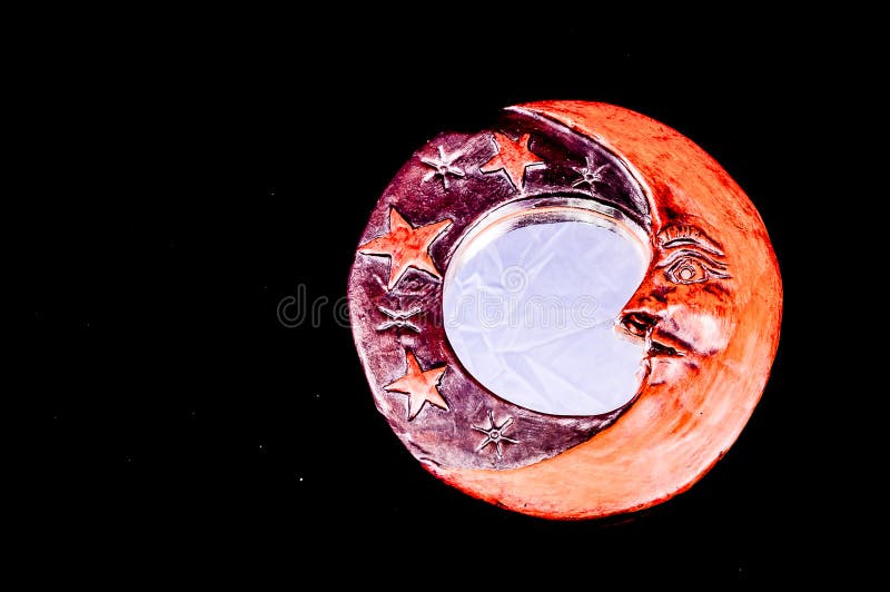 A Small, Round, Red and Gold Moon with Stars on it Stock Photo - Image ...