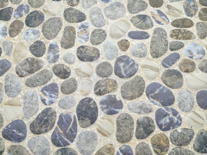 Small Round Stones and Rocks in Cement for Interesting Design Flooring ...
