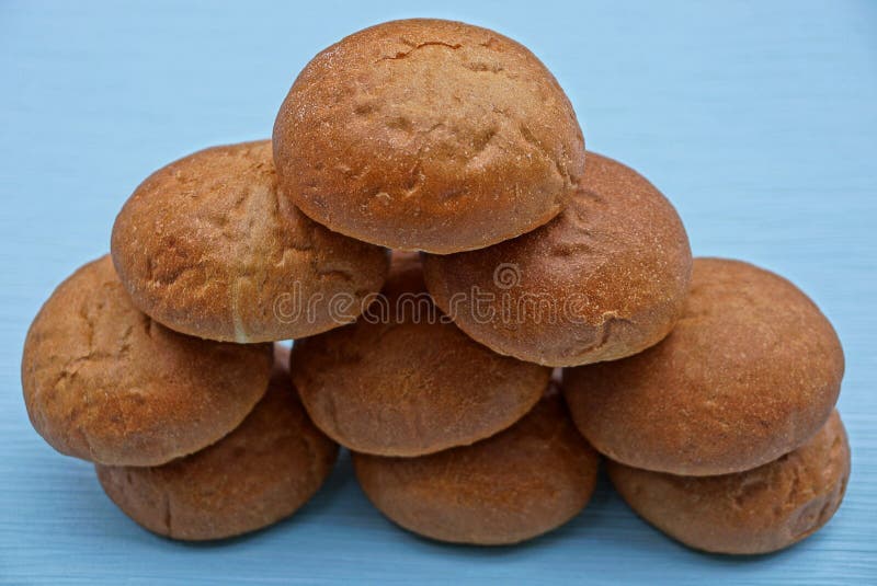 A Roll of Round Wheat Rolls on a Table Stock Image - Image of dough ...