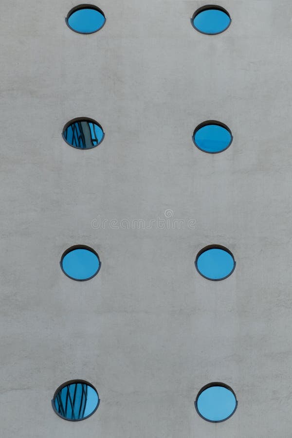 Small Round Windows on the Concrete Wall of the Building Stock Photo ...