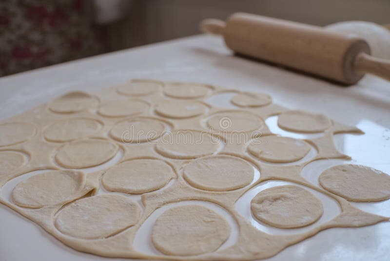 Small Rounds Cut Out of Piece of Dough in Process of Preparing ...
