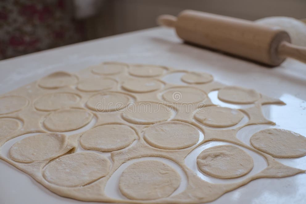 Small Rounds Cut Out of Piece of Dough in Process of Preparing ...