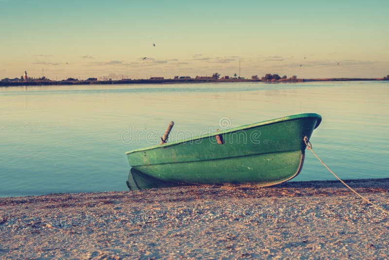 Small Row Boat on Coastline during Sunrise Stock Photo - Image of ...