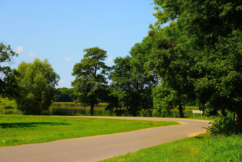A Small Rural Road Along Which Trees Grow Stock Image - Image of lane ...