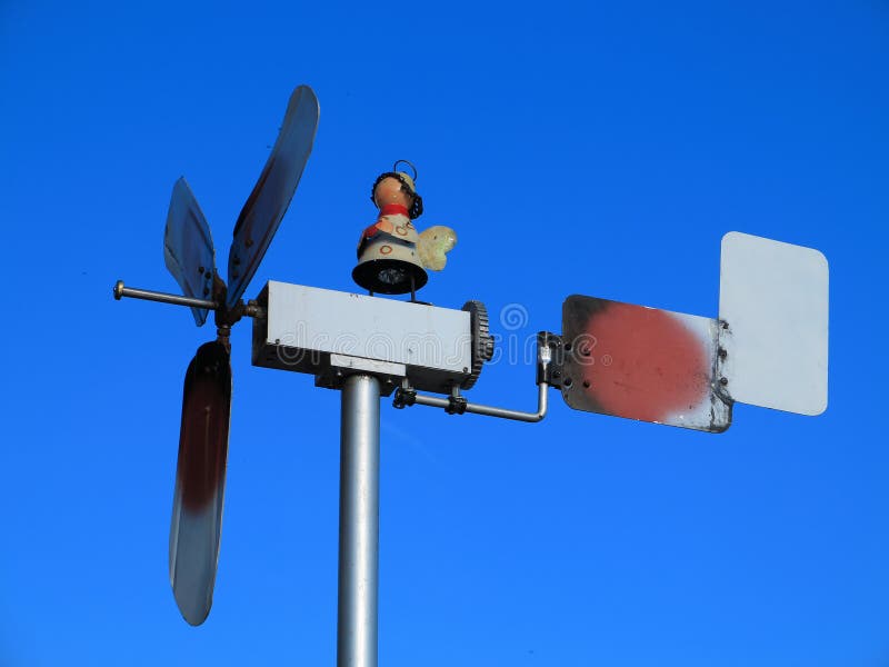 Small Rustic Windmill with Figurine Against Blue Sky Stock Photo ...