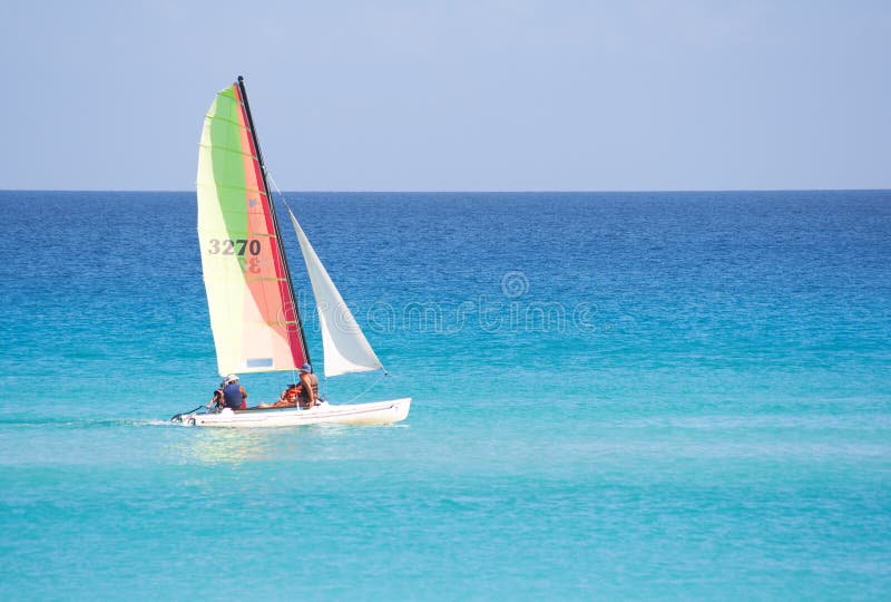 Small Sailboat in a Calm Blue Sea Stock Photo - Image of nature, sport ...