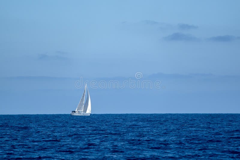 Small Sailboat on Deep Blue Sea Stock Photo - Image of sail, amazing ...
