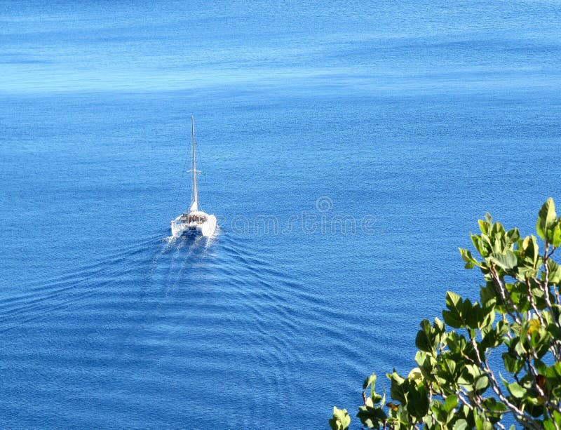Small sailboat in the sea editorial stock photo. Image of water - 206904323