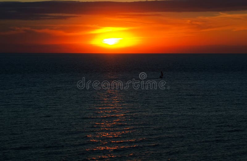 Small Sailboat in the Sea at Sunset. Stock Photo - Image of break ...