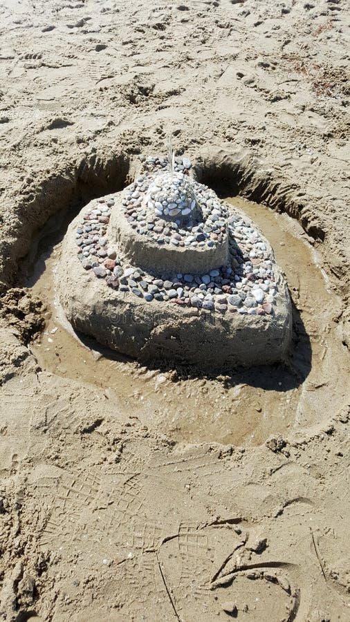 Small Sandcastle with Stones and Shells Stock Image - Image of ...