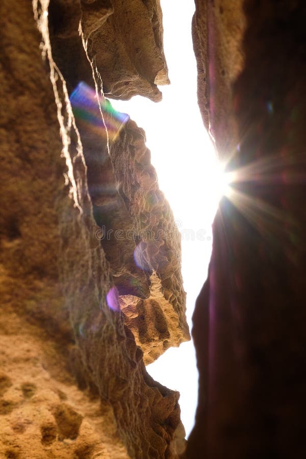 A Small Sandstone Cave Divided by Huge Cracks and Illuminated by the ...