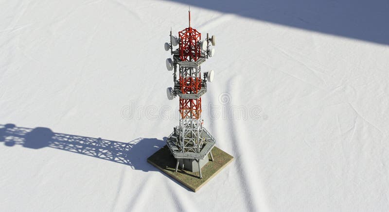 A Small-scale Model of a Telecommunications Tower Stands on a White ...