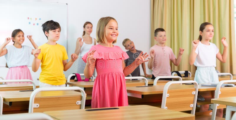 Small School Kids Doing Physical Exercises with Teacher Stock Photo ...