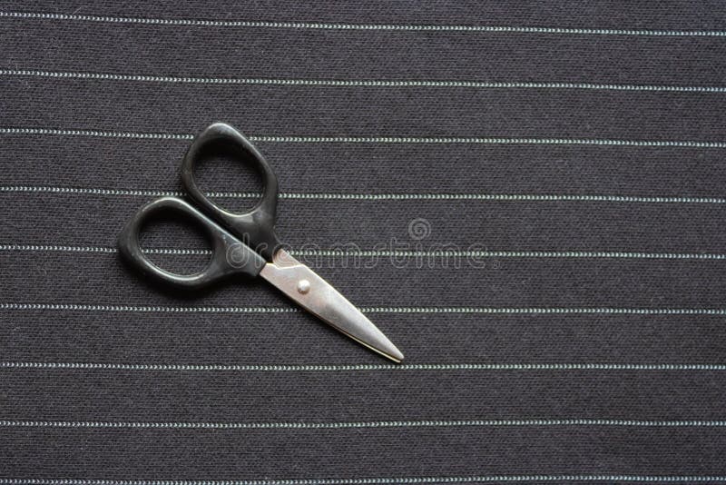Small Scissors on the Striped Fabric Background - Image Stock Photo ...