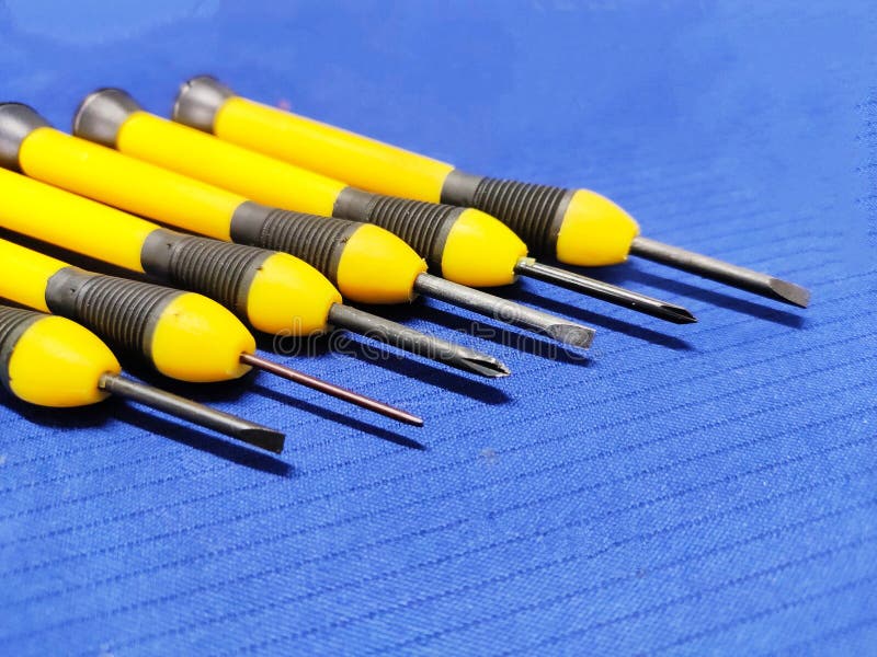 Small Driver Mini Precision Set on Blue Textured Background. Stock ...