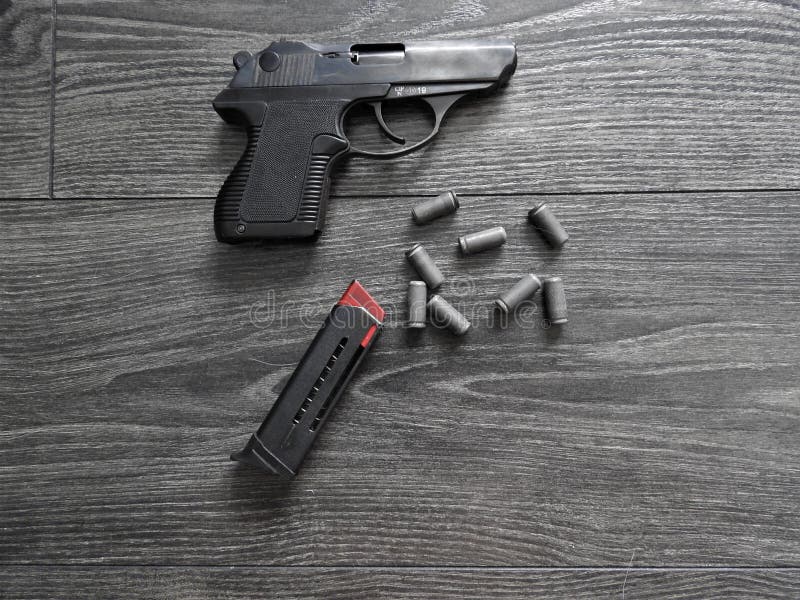 Small Self-loading Pistol PSM 18 Mm, with Cartridges on a Dark ...