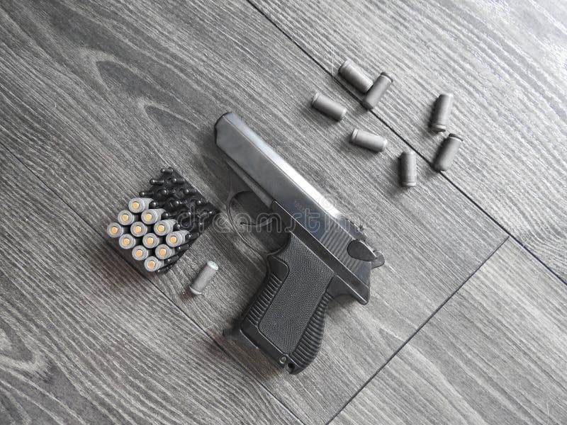 Small Self-loading Pistol PSM 18 Mm, with Cartridges on a Dark ...