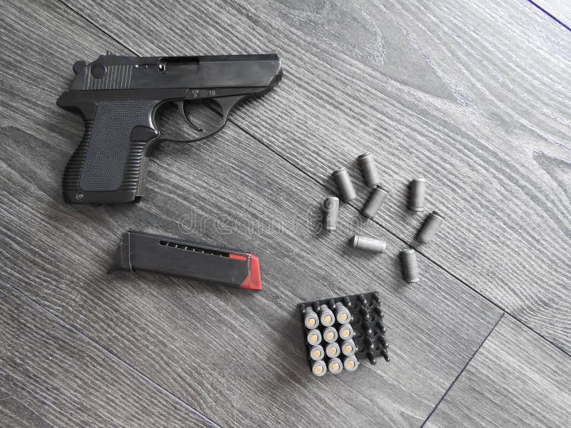 Small Self-loading Pistol PSM 18 Mm, with Cartridges on a Dark ...
