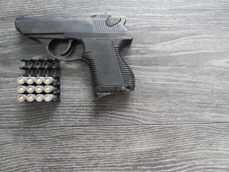 Small Self-loading Pistol PSM 18 Mm, with Cartridges on a Dark ...