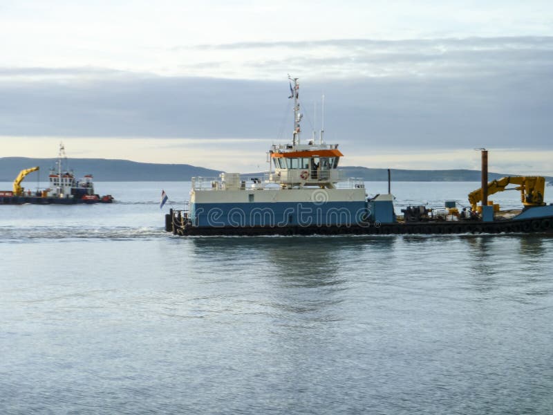 A Small Service Ship in a Cargo Industrial Port. a Ship in the Sea ...