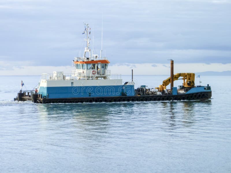 A Small Service Ship in a Cargo Industrial Port. a Ship in the Sea ...