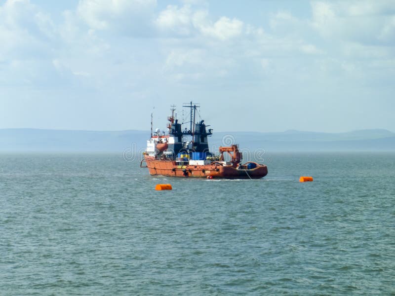 A Small Service Ship in a Cargo Industrial Port. a Ship in the Sea ...
