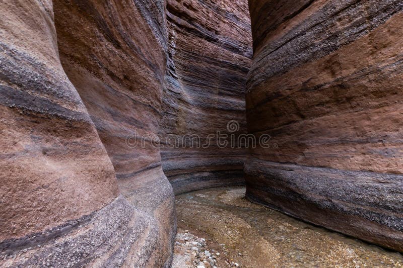 A Small Shallow Stream Flows between High Rocks with Beautiful Natural ...