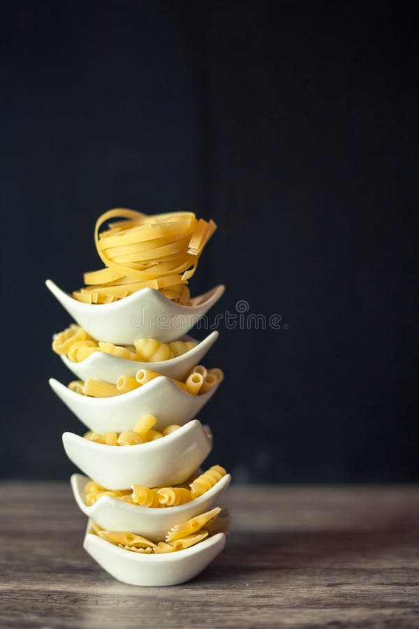 Small Shaped Pasta Arranged in White Bowls Stock Photo - Image of space ...