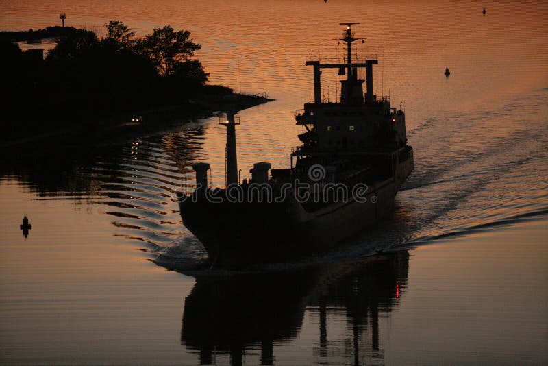 A Small Ship Crousing during a Sunset Stock Image - Image of filtered ...