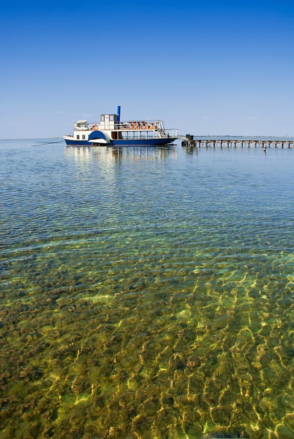 Small Ship Anchored in a Harbor Stock Photo - Image of reflected ...