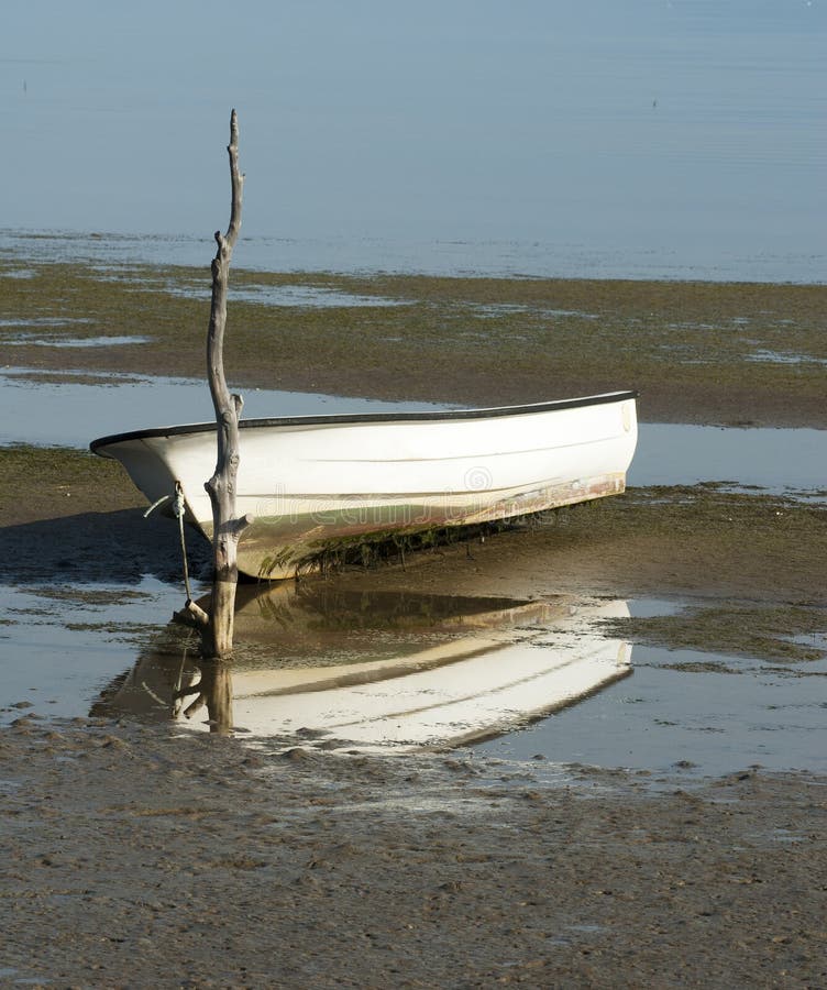 A Small Ship Stranded on Sand Stock Photo - Image of immovable, blue ...