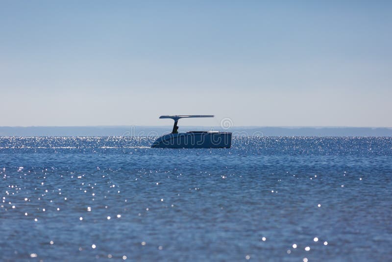 Small Ship Swimming on Sea Surface Stock Photo - Image of landscape ...