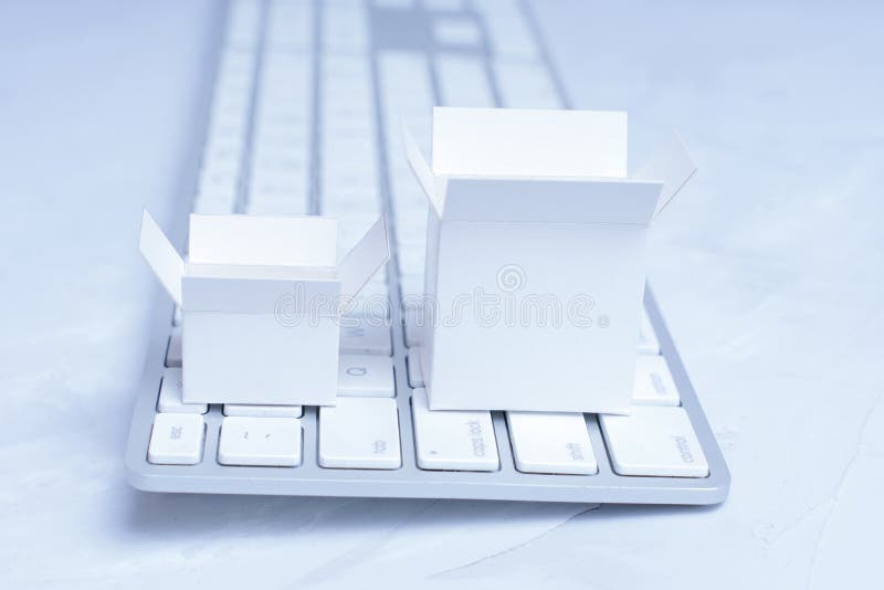 Small Shipping Boxes Placed on a Keyboard Stock Image - Image of cargo ...