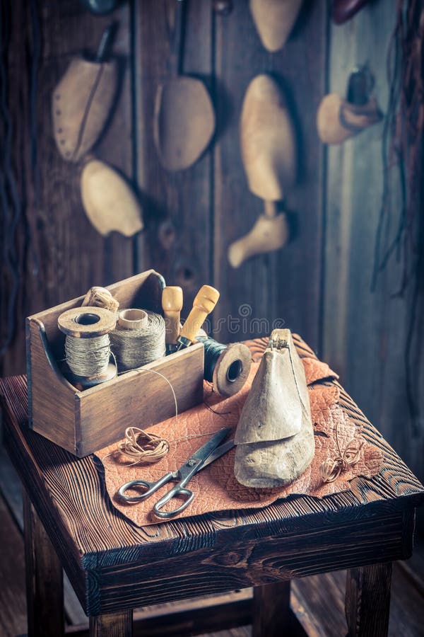 Small Shoemaker Workshop with Shoes, Laces and Tools Stock Image ...