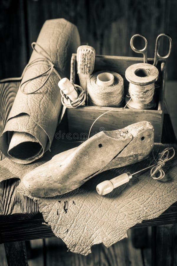 Small Shoemaker Workshop with Tools, Shoes and Laces Stock Photo ...
