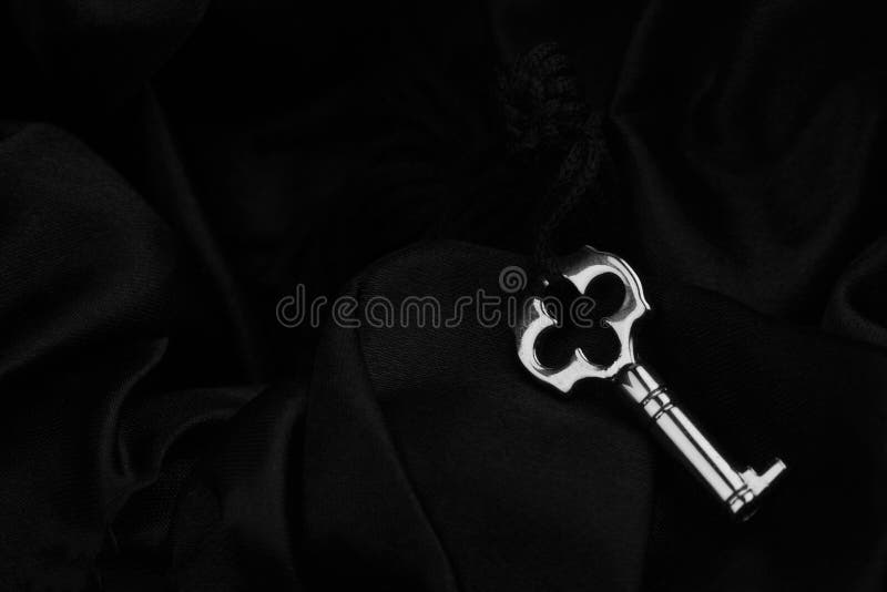 Small Silver Key on Dark Silk Background Stock Photo - Image of ...