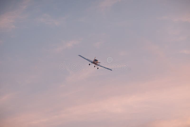 Small Single Engine Airplane Flying Against Sunset Sky Stock Photo ...