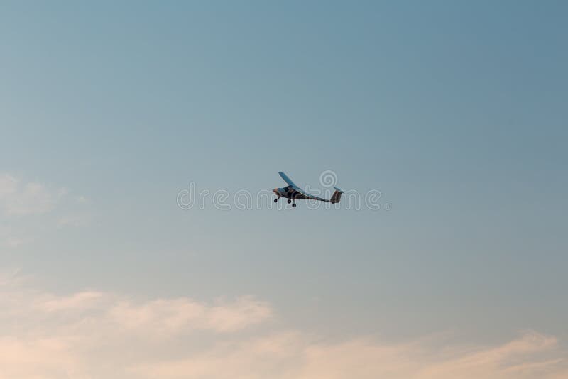 Small Single Engine Airplane Flying Against Sunset Sky Stock Photo ...