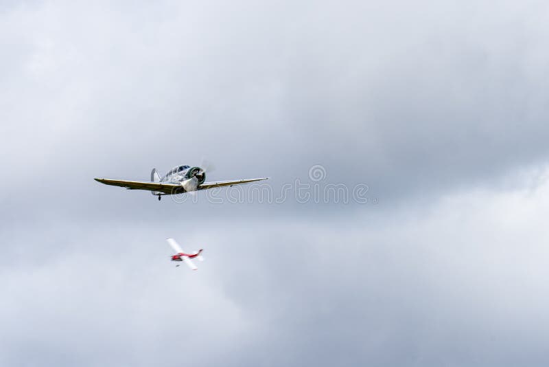 Small Single Engine Airplane Flying in the English Cloudy Sky Editorial ...