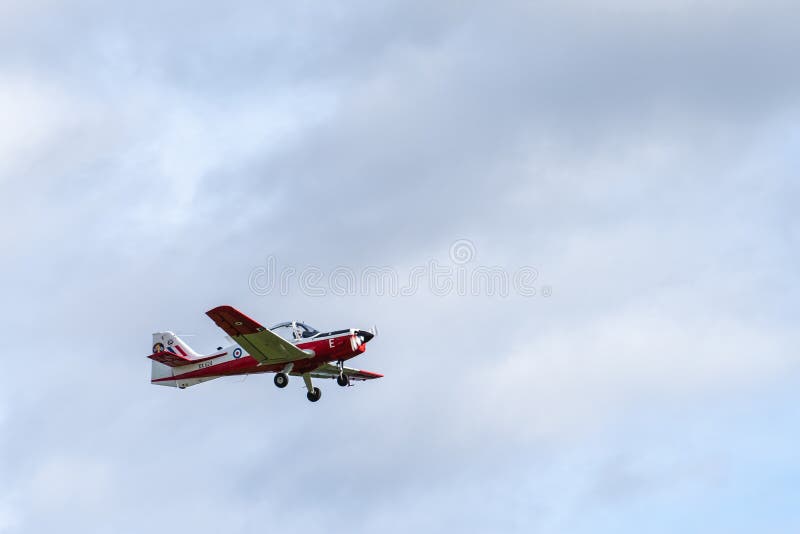 Small Single Engine Airplane Flying in the English Cloudy Sky Editorial ...