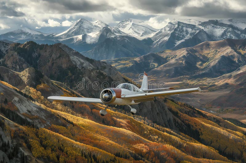A Small, Single-engine Plane Flying Over a Rugged Mountain Range, with ...