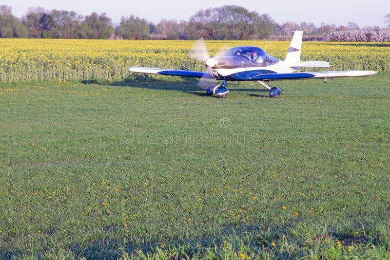 A Single-engine Plane Takes Off from the Meadow Stock Image - Image of ...
