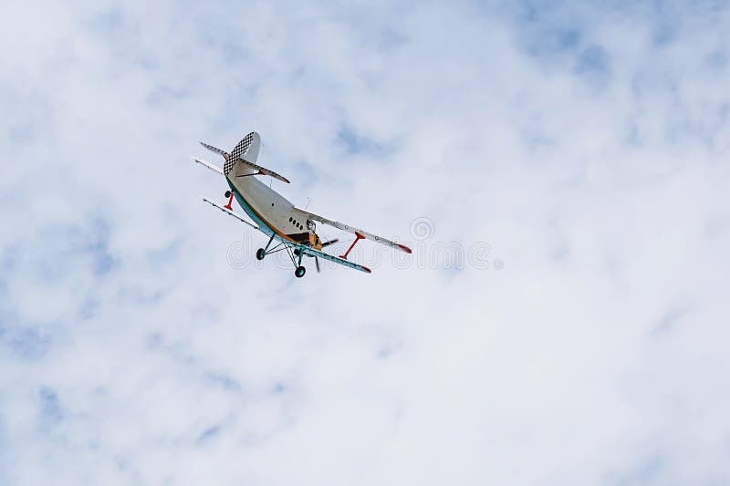 Small Single Engine Vintage Colorful Airplane in a Blue Cloudy Sky ...