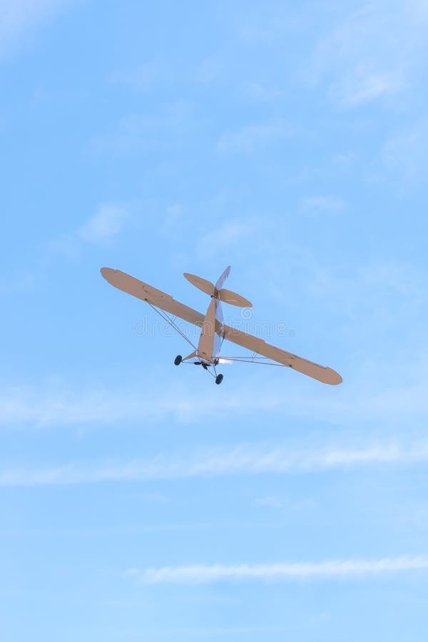 Small Single-engine Old Vintage Plane Flying Against the Blue Sky Stock ...