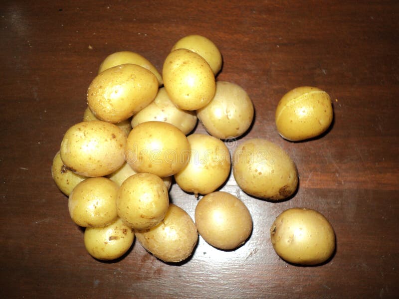 Small Size Potatoes with a Brown Background Stock Image - Image of ...