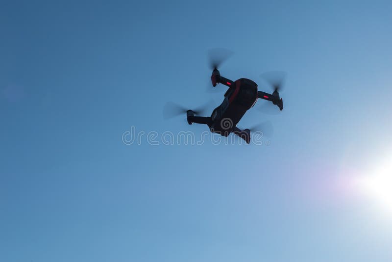 Small Sized Red Drone with High Resolution Camera Hovering in Air for ...