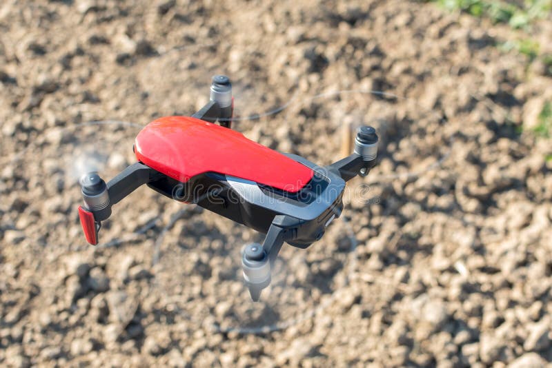Small Sized Red Drone with High Resolution Camera Hovering in Air for ...